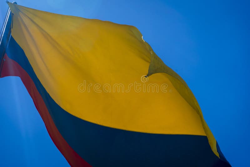 Colombia Flag Waving in a Blue Cloudy Sky Stock Photo - Image of ...