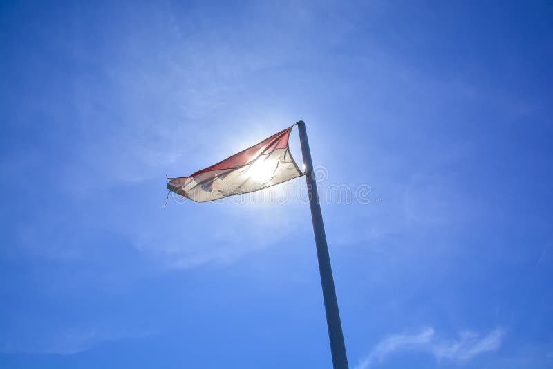 A Flag of Red, White, and Blue Waves in the Wind Against the Sky Stock ...