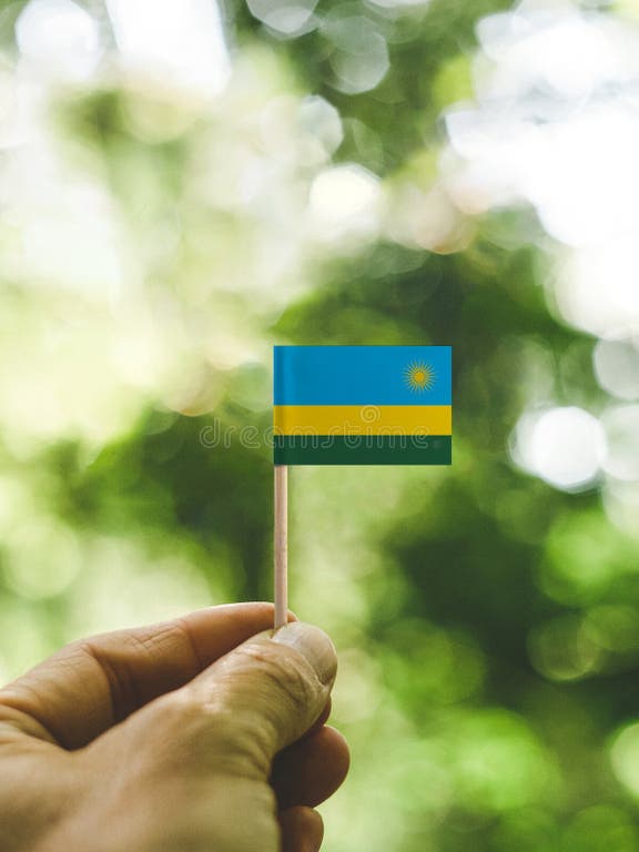 The Flag of the Rwanda Which is Held in Hand. Stock Image - Image of ...