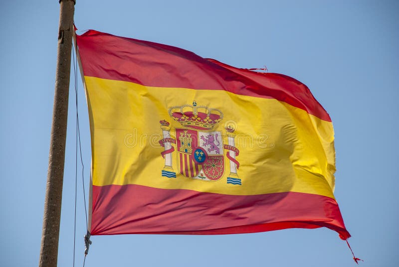 Flag of Spain on a pole stock image. Image of waving - 135930857