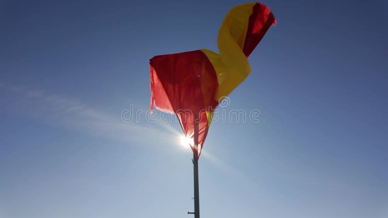 Flag of Spain Waving in the Wind with Rays of the Sun Appearing ...