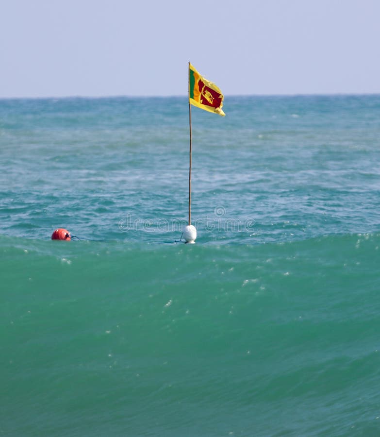 The Flag of Sri Lanka Floats in the Indian Ocean. Stock Image - Image ...