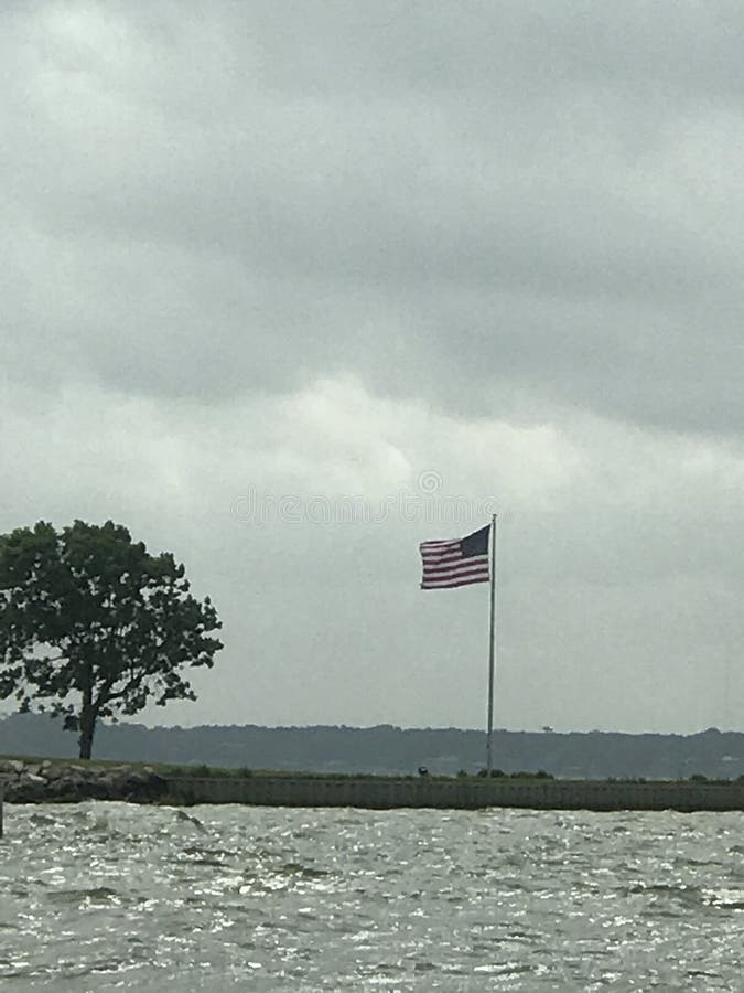 Flag in the storm stock image. Image of outdoors, storm - 99701975