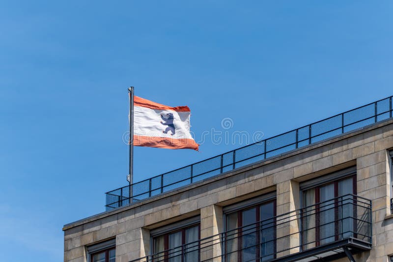 The Flag of the Symbol of Berlin Flutters on the Corner of the Building ...