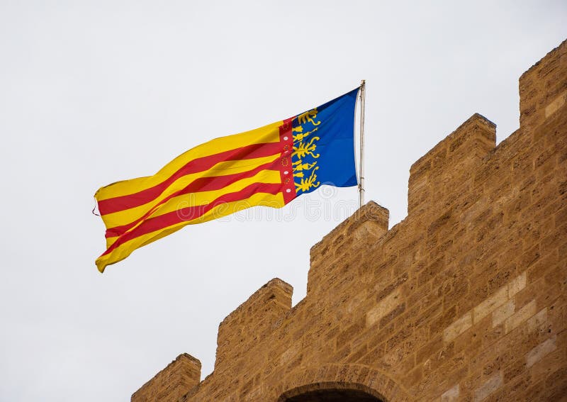 Flag Of Valencia, Spain, Waving In The Wind In Front Of A Blue Sky ...