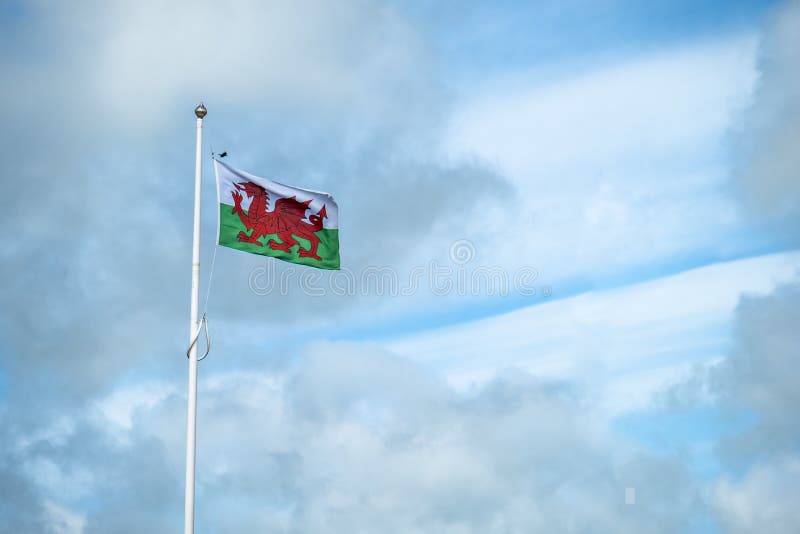 Welsh Flag Waving in the Beautiful Landscape of Llanberis, Snowdonia in ...