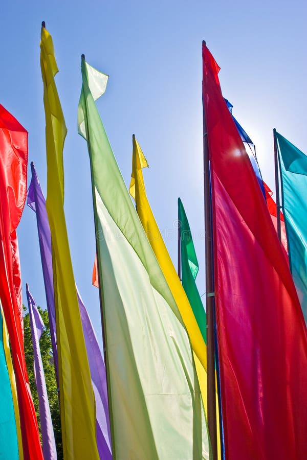Multicoloured Narrow Long Flags Against Blue Sky Stock Image - Image of ...