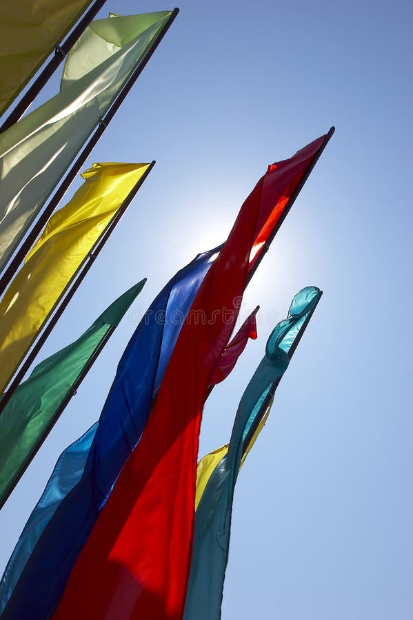 Multicoloured Narrow Long Flags Against Blue Sky Stock Image - Image of ...
