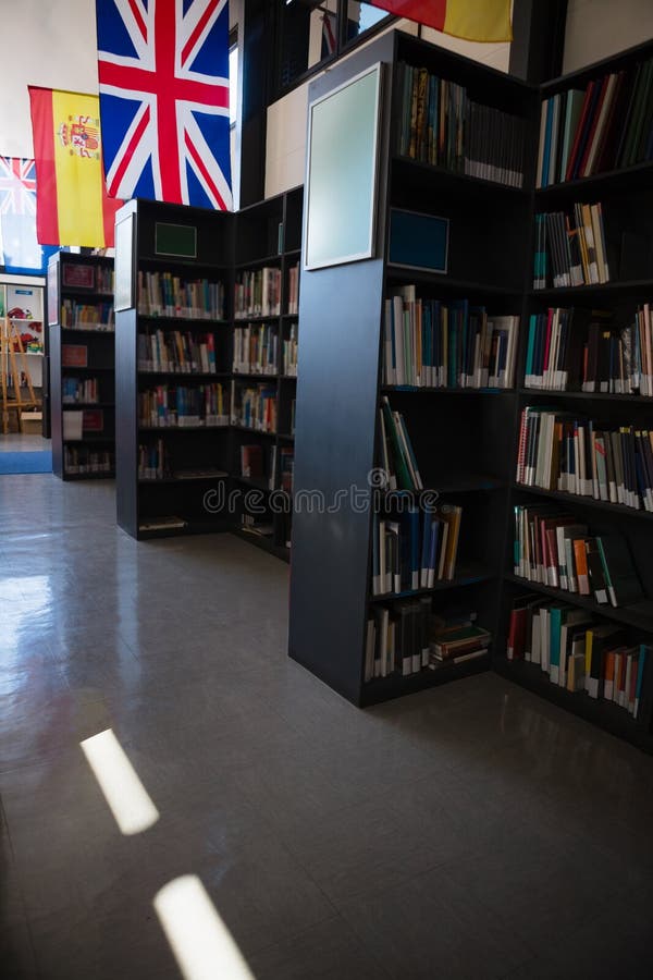 Flags by Bookshelf in Library Stock Photo - Image of stack, bookshelf ...