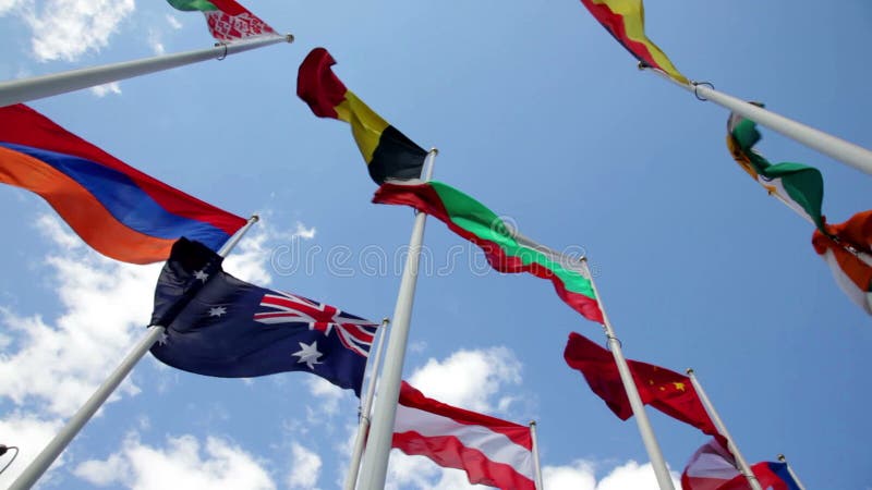 Flags of the World Waving in the Wind on a Background Blue Sky and ...