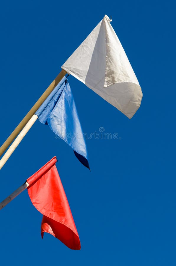 Flags of Different Colors on the Background of Blue Sky. Stock Image ...
