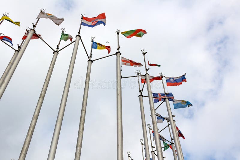Flags of Different Countries on Cloudy Sky Background Stock Image ...