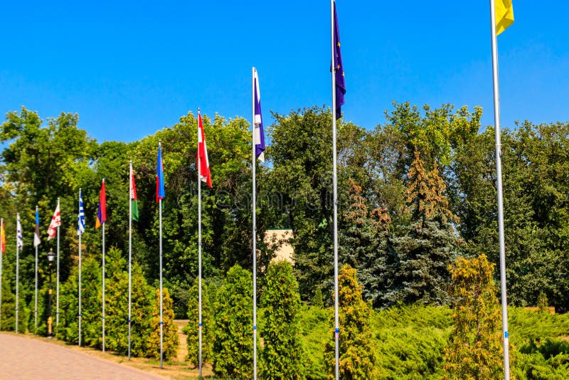 Flags of Different Countries on High Flagpoles in Park Stock Image ...