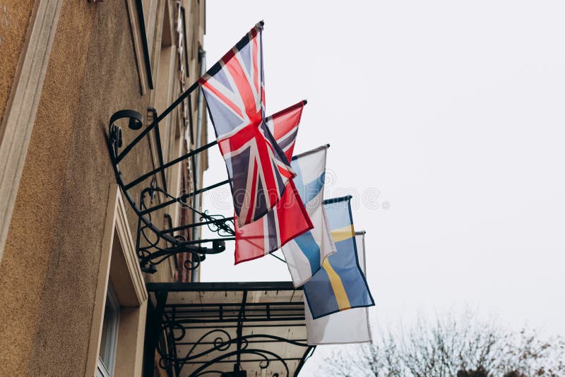 Flags of Different Countries on the Wall of the Building. Flags in the ...