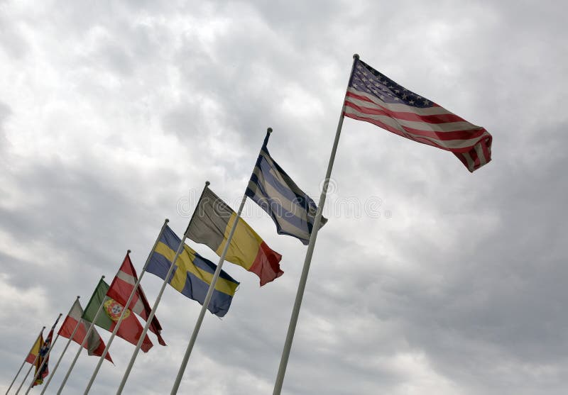 Flags of Different Countries Waving Against a Cloudy Sky Stock Image ...