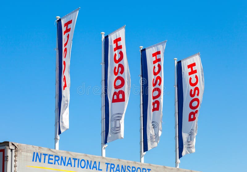Flags with Emblem Bosch Against the Blue Sky Editorial Photo - Image of ...