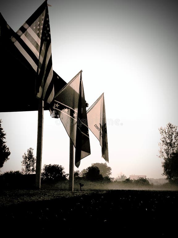 Flags flying fog rising stock photo. Image of flags - 227306006