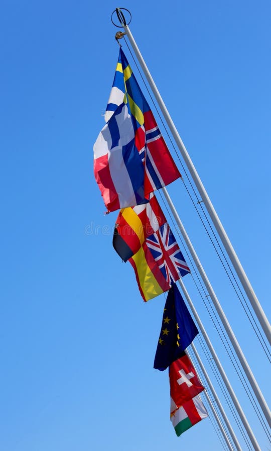Flags of Many Nations World Waving in the Blue Sky Stock Image - Image ...