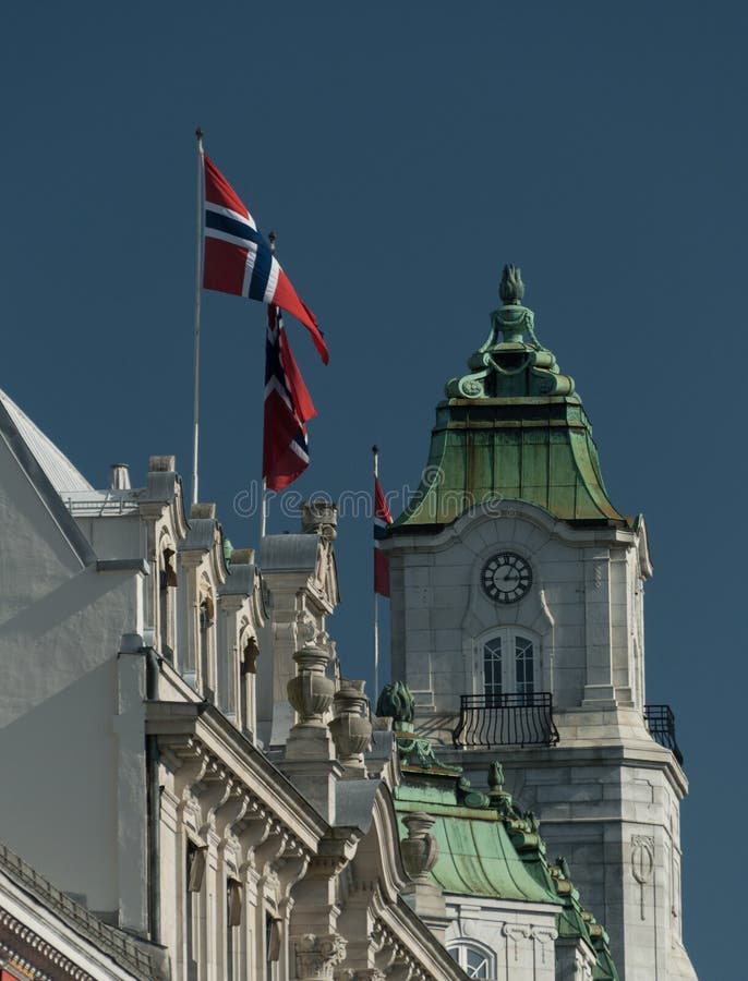Flags of Norway Waving High in Front of Clock Tower on Karl Johans Gate ...