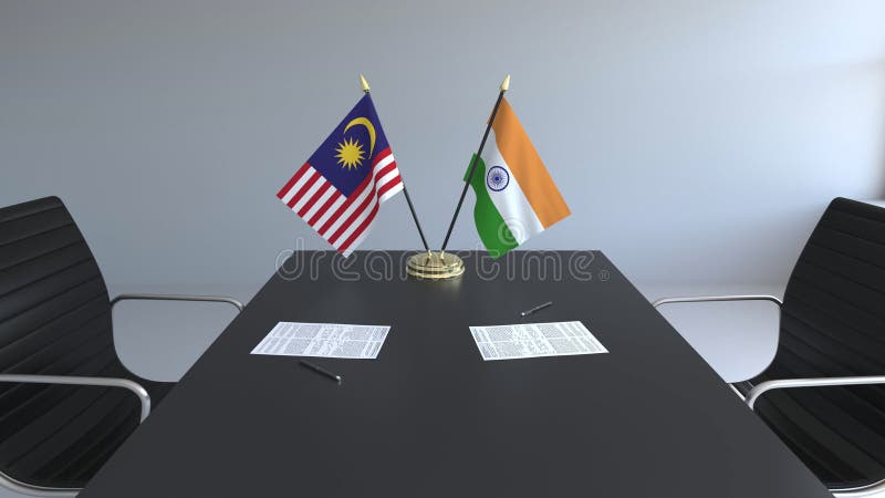 Flags of Malaysia and India and Papers on the Table. Negotiations and ...