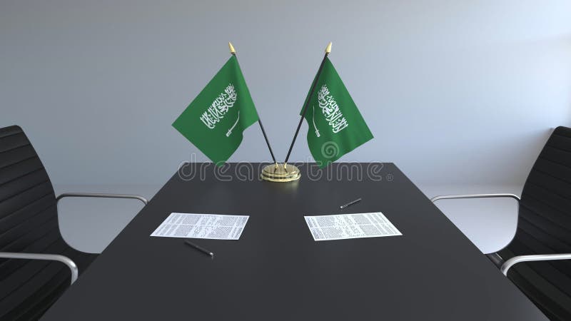 Flags of Saudi Arabia and Papers on the Table. Negotiations and Signing ...