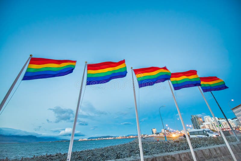 Flags Symbolizing Peace Waving at Sunset Along the Ocean Stock Photo ...