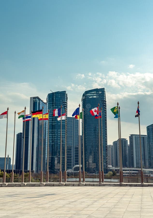 Flags of Various Nations Wave in Front of Modern Skyscrapers. Stock ...