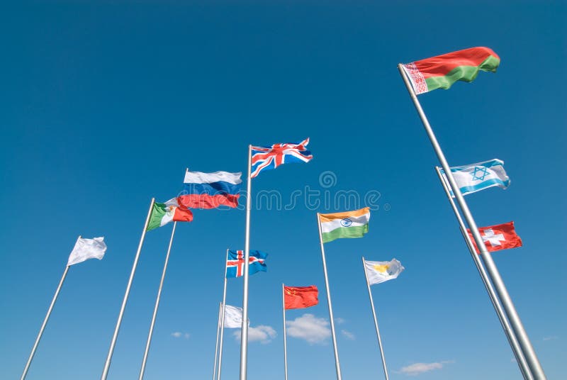 Flags Waving Across Blue Sky Stock Photo - Image of sunlight, waves ...