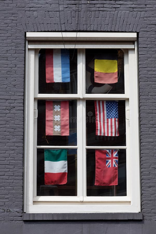 Flags in Window stock photo. Image of holland, glass - 158767998