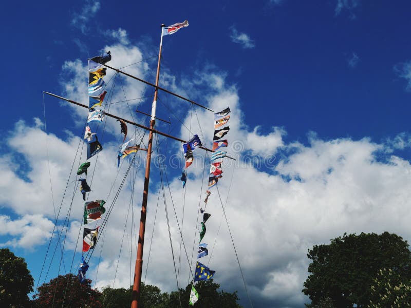 Flagstaff with Various Flags in Strong Wind Stock Photo - Image of ...