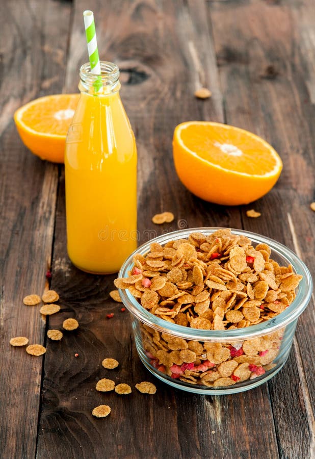Flakes in Bowl with Orange on Dark Wooden Background Stock Photo ...