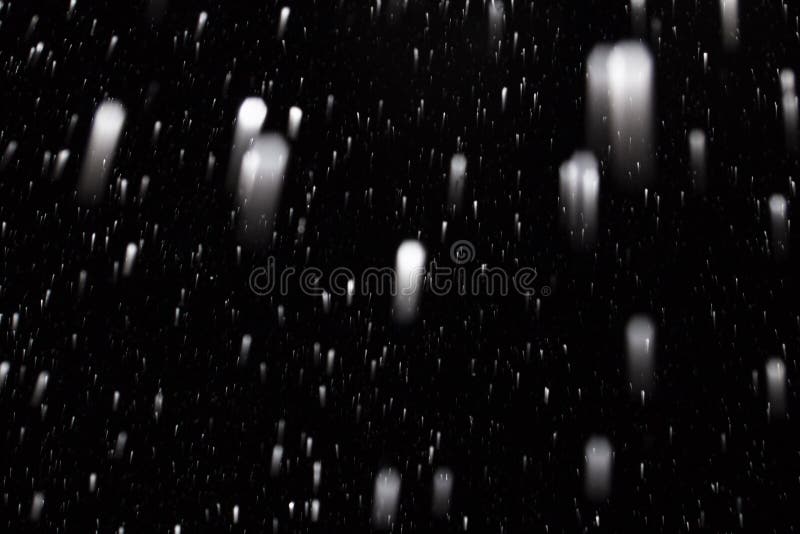 Flakes of Snow Falling Fast Against a Black Sky, the Front and ...