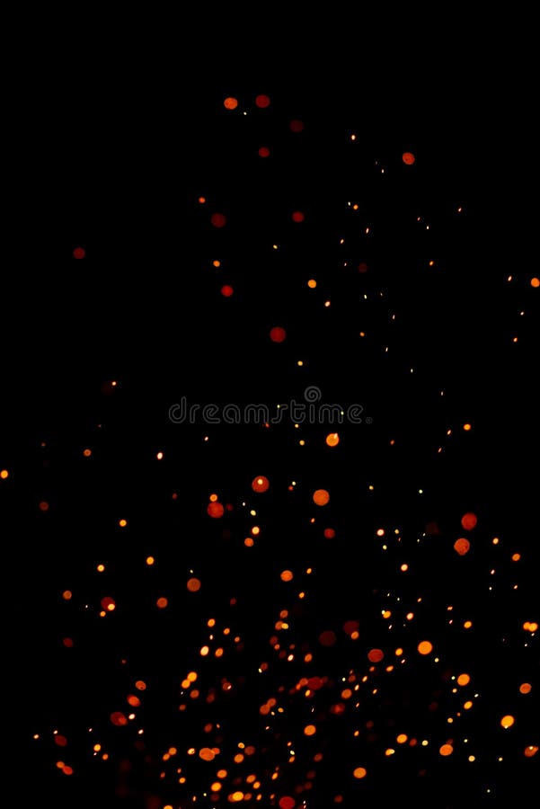 Flame of Fire with Sparks in the Air Over a Dark Night Stock Photo ...