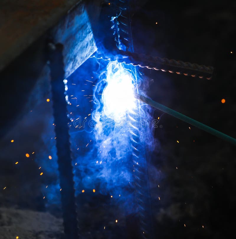Flame of Fire and Sparks from Welding Metal at Night Stock Image ...