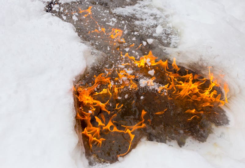 Flame of Fire on White Snow in Winter Stock Image - Image of water ...