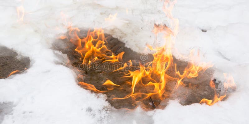 Flame of Fire on White Snow in Winter Stock Photo - Image of texture ...