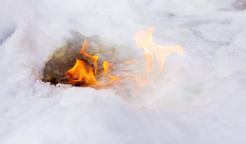 Flame of Fire on White Snow in Winter Stock Photo - Image of texture ...