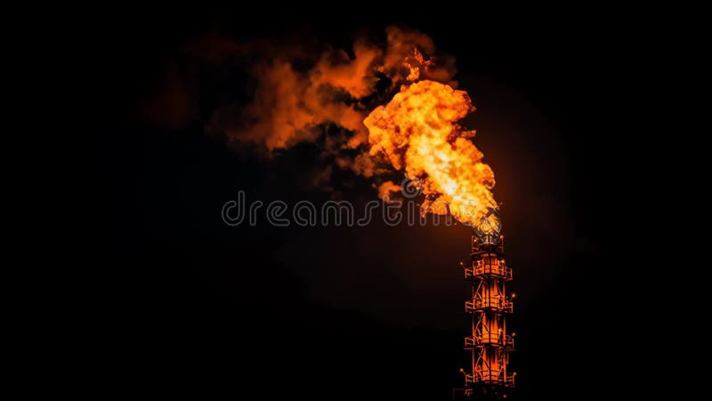 Flame Flare Stack at Refinery Lights Up Night Sky with Bright Orange ...
