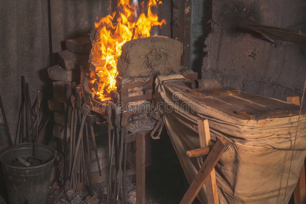Flame in a Forge with Hand-made Bellows in an Old Rural Workshop. Stock ...