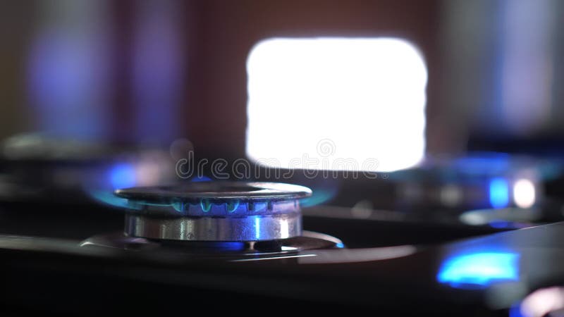 Lighting a Fire on a Gas Stove. Flame Gas Burner Operation Stock ...