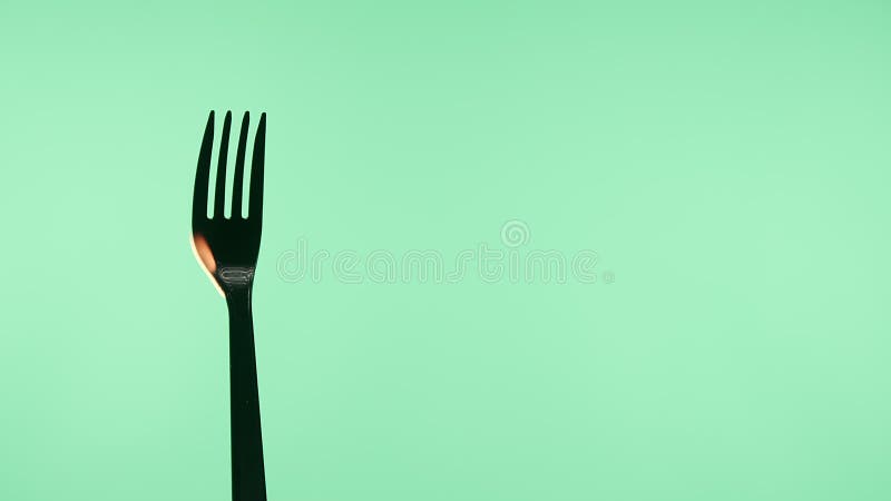 Flame Gas Lighter Burns Black Disposable Plastic Fork on Green Screen ...