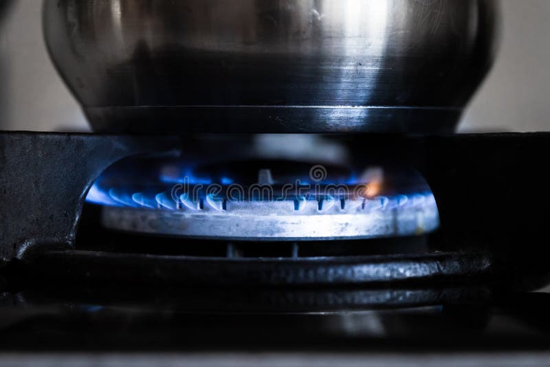 Flame from Natural Gas on a Stove Burner with a Cooking Pot Stock Image ...
