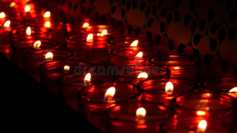 Flames of Burning Red Candles in a Row in a Catholic Church Stock ...