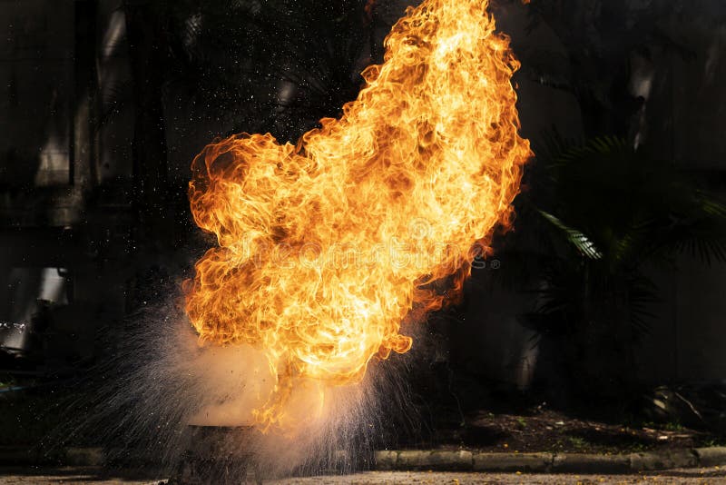 Flames Caused by the Explosion of the Oil. Demonstration of Water on ...