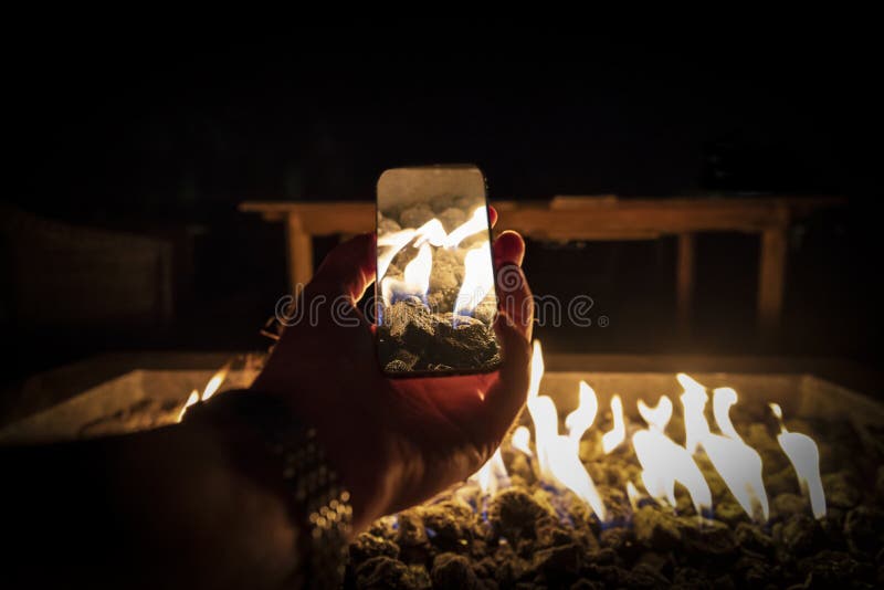 Flames on screen of phone stock image. Image of outside - 171141101