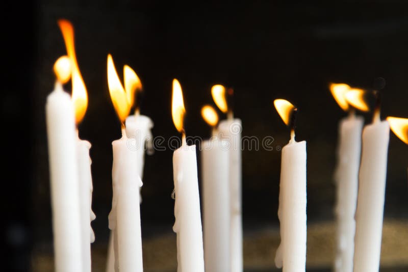 Flaming Candles for Prayer stock image. Image of fire - 48126371
