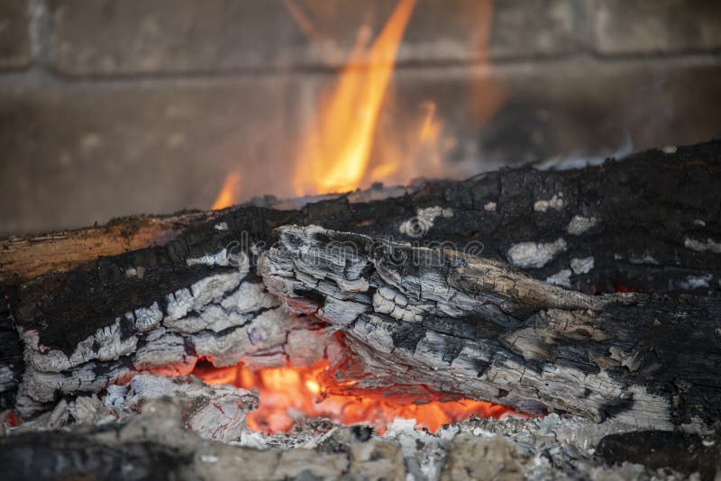 Flaming Fire in an Extinguished Stone Fireplace, Horizontal Stock Photo ...
