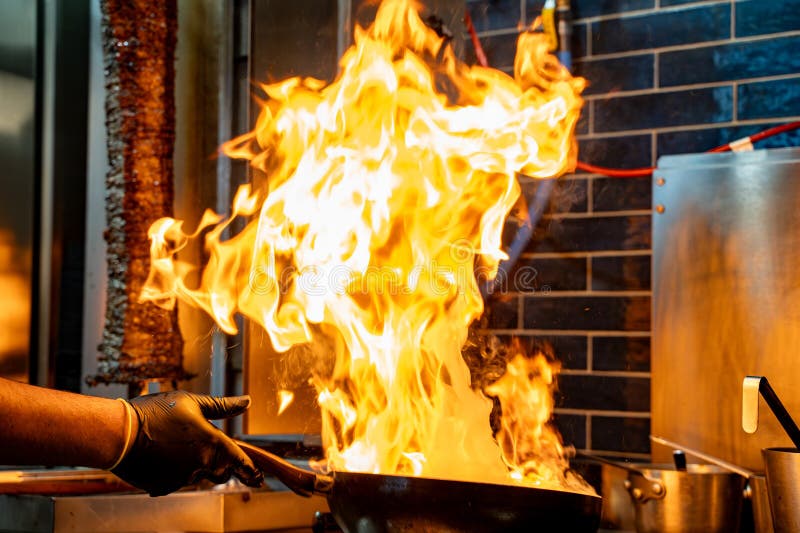 Flaming Pan in a Restaurant Kitchen Stock Photo - Image of preparation ...