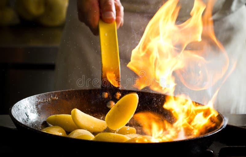 Flaming potatoes stock photo. Image of grilling, cook - 26480990