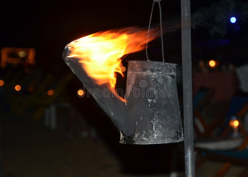 Flaming Torch Created from Watering Can Photography Stock Image - Image ...